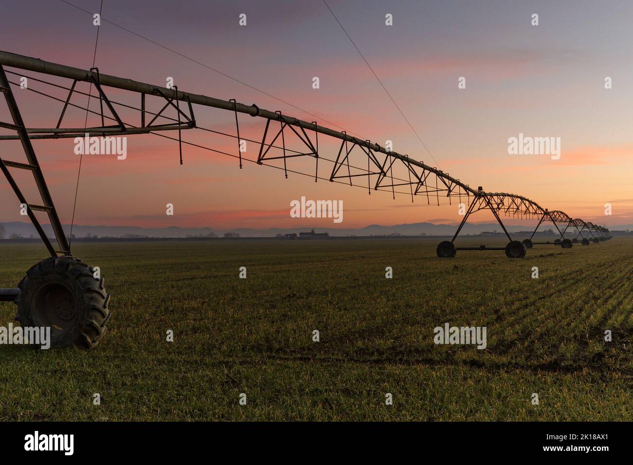 A pivot irragation system in field during sunset Stock Photo - Alamy