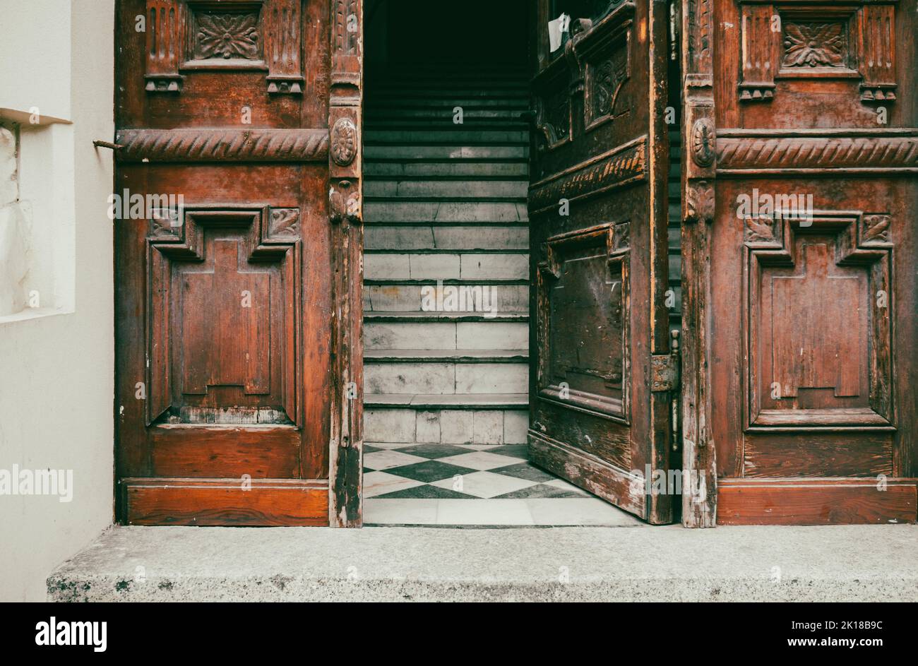 An opened old entry door of an ancient building Stock Photo - Alamy