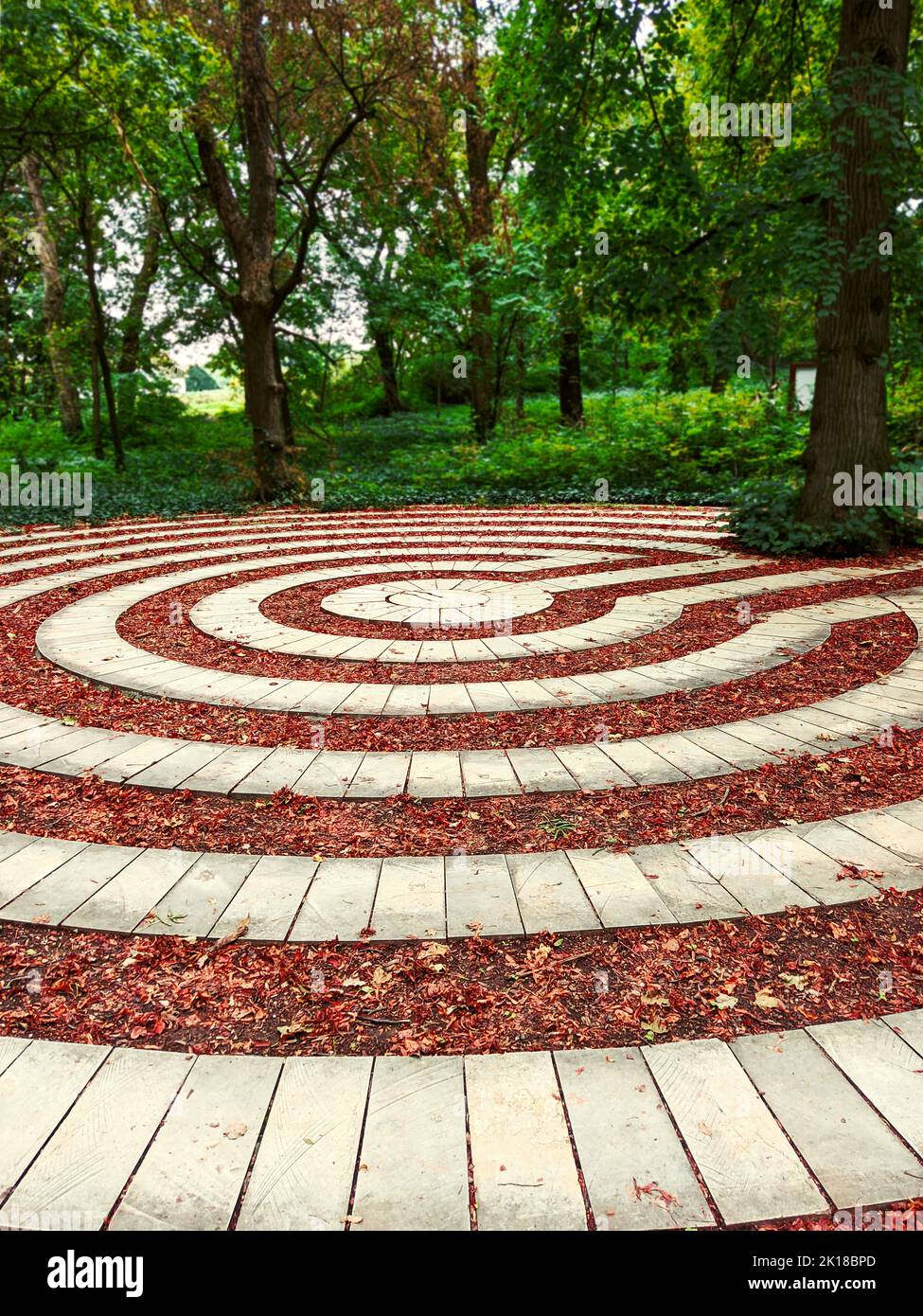 round shape architecture with stones within forest, arboretum Stock ...
