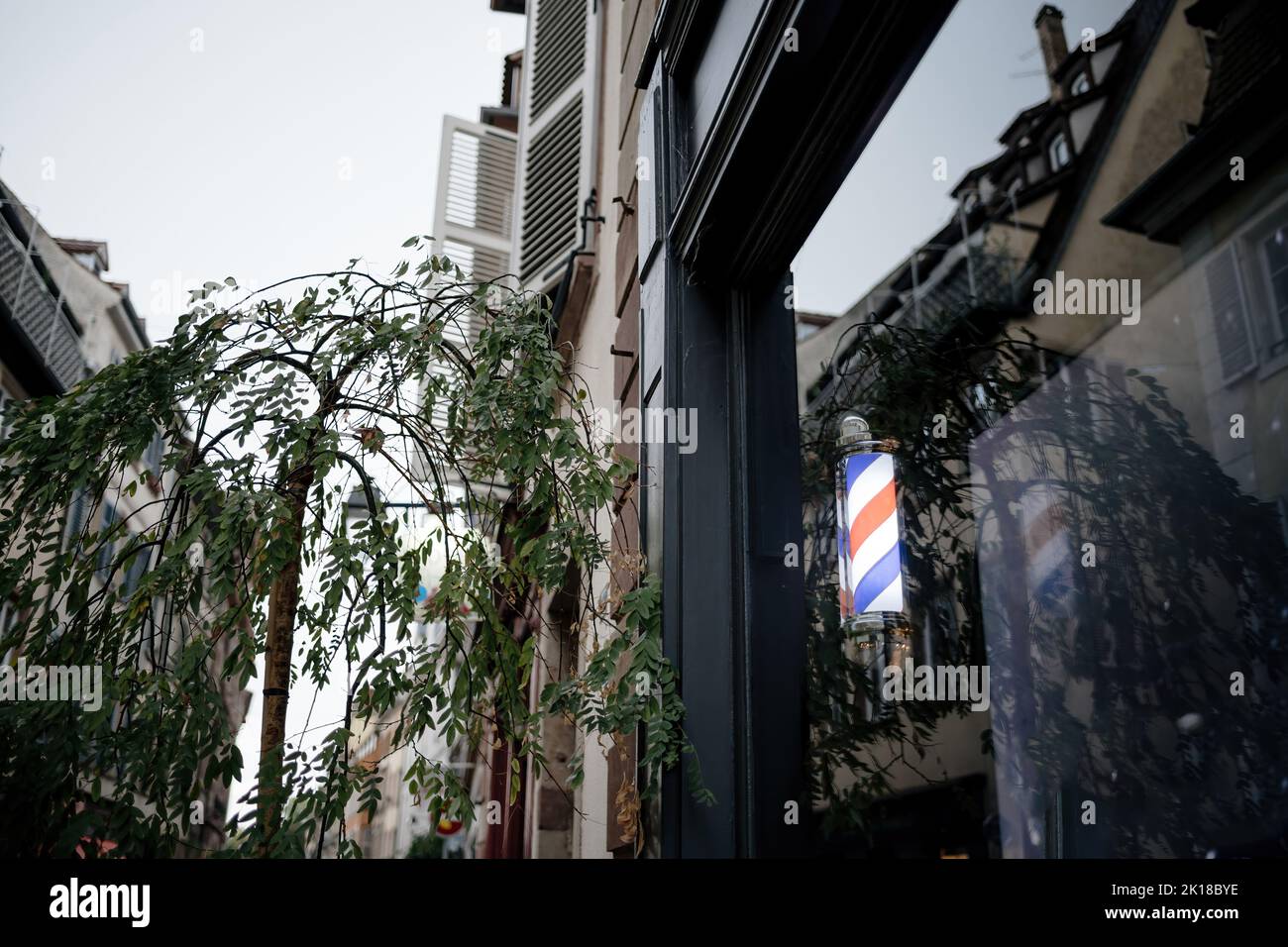 Barber-shop sign on the glass showcase of a facade building - low angle ...