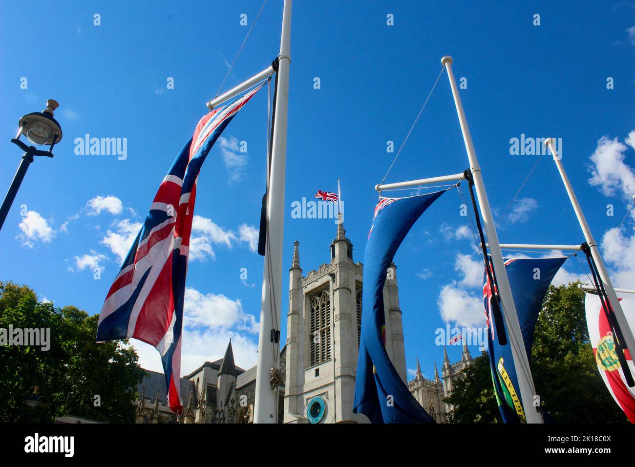 westminster abbey, parliament square with commonwealth flags; scenes ...