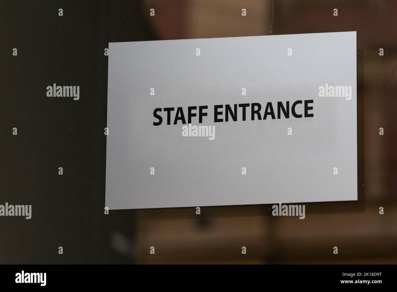Staff Entrance Sign Info at Glass Door Stock Photo - Alamy