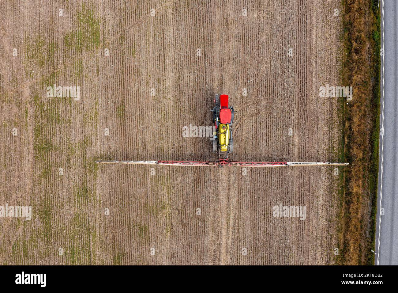 An aerial view of a tractor working in the farm field Stock Photo - Alamy