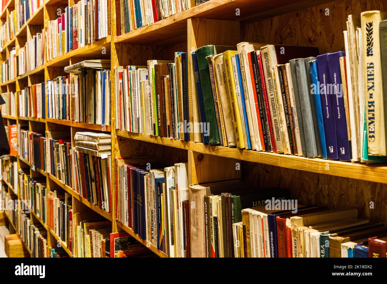 Old vintage books on a wooden shelf in the library Stock Photo - Alamy