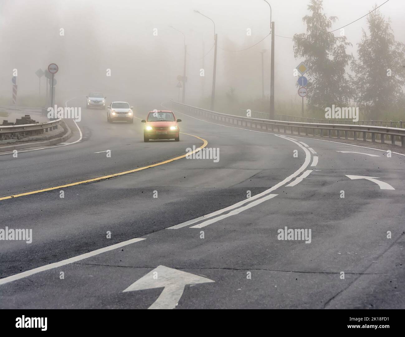 City street on a foggy morning with traffic Stock Photo - Alamy