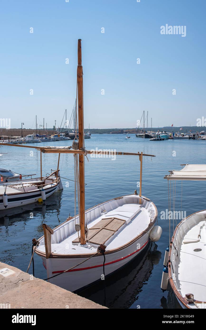 Traditional fishing boats in the harbour of Fornells in Menorca, Spain ...