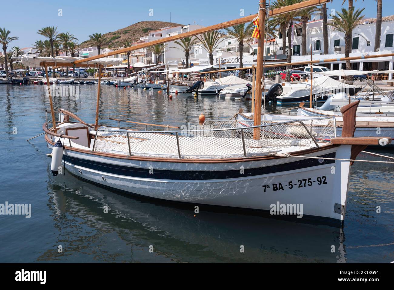 Traditional fishing boats in the harbour of Fornells in Menorca, Spain ...