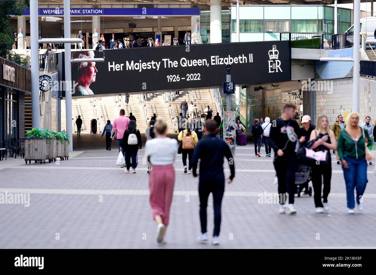 A tribute to Queen Elizabeth II is displayed over the stairs to Wembley ...