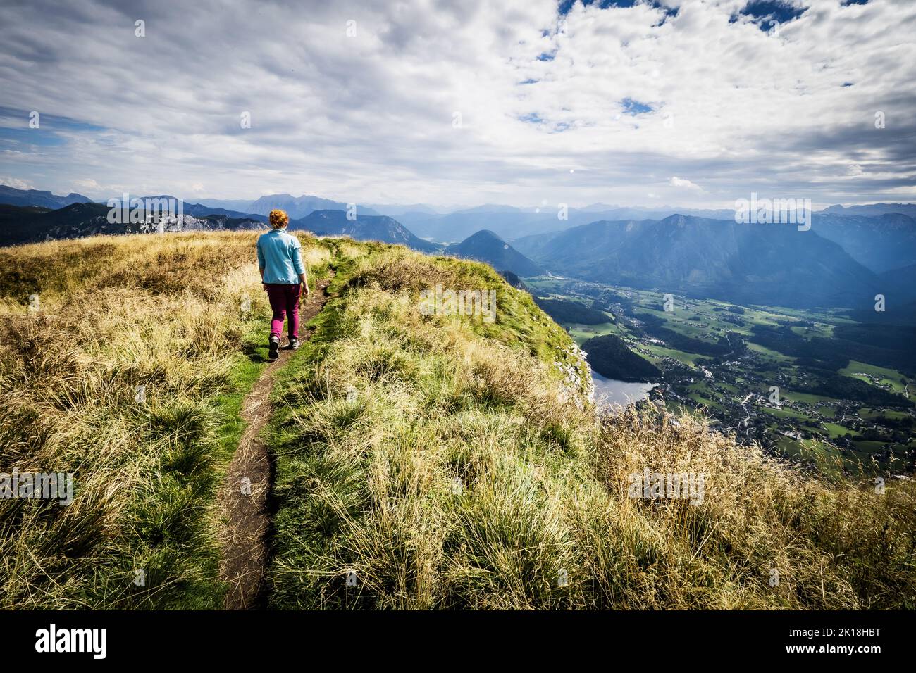 Woman walking along top ridge hi-res stock photography and images - Alamy