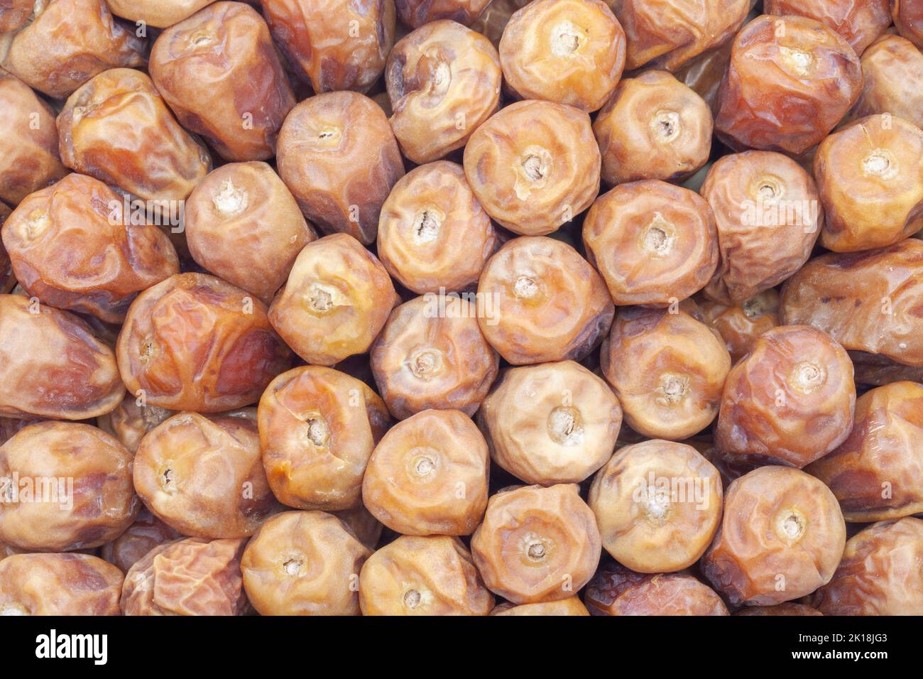 A group of stuffed sukkari dates with nuts and herbs isolated on white ...