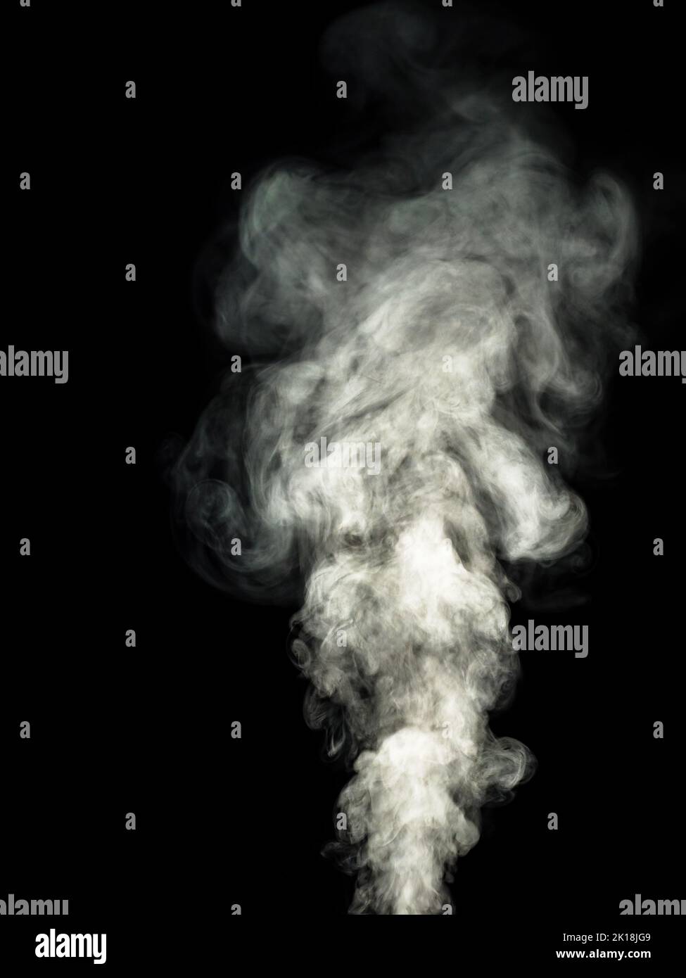 Thick white smoke on a black background, rising tubers upwards as an ...
