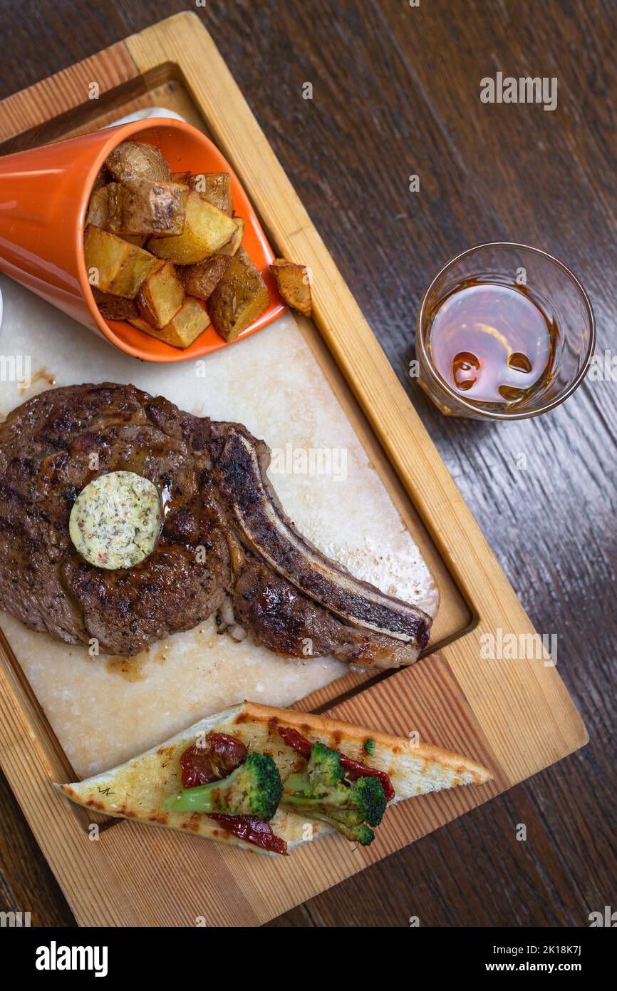 steak with potatoes and alcohol top view Stock Photo - Alamy