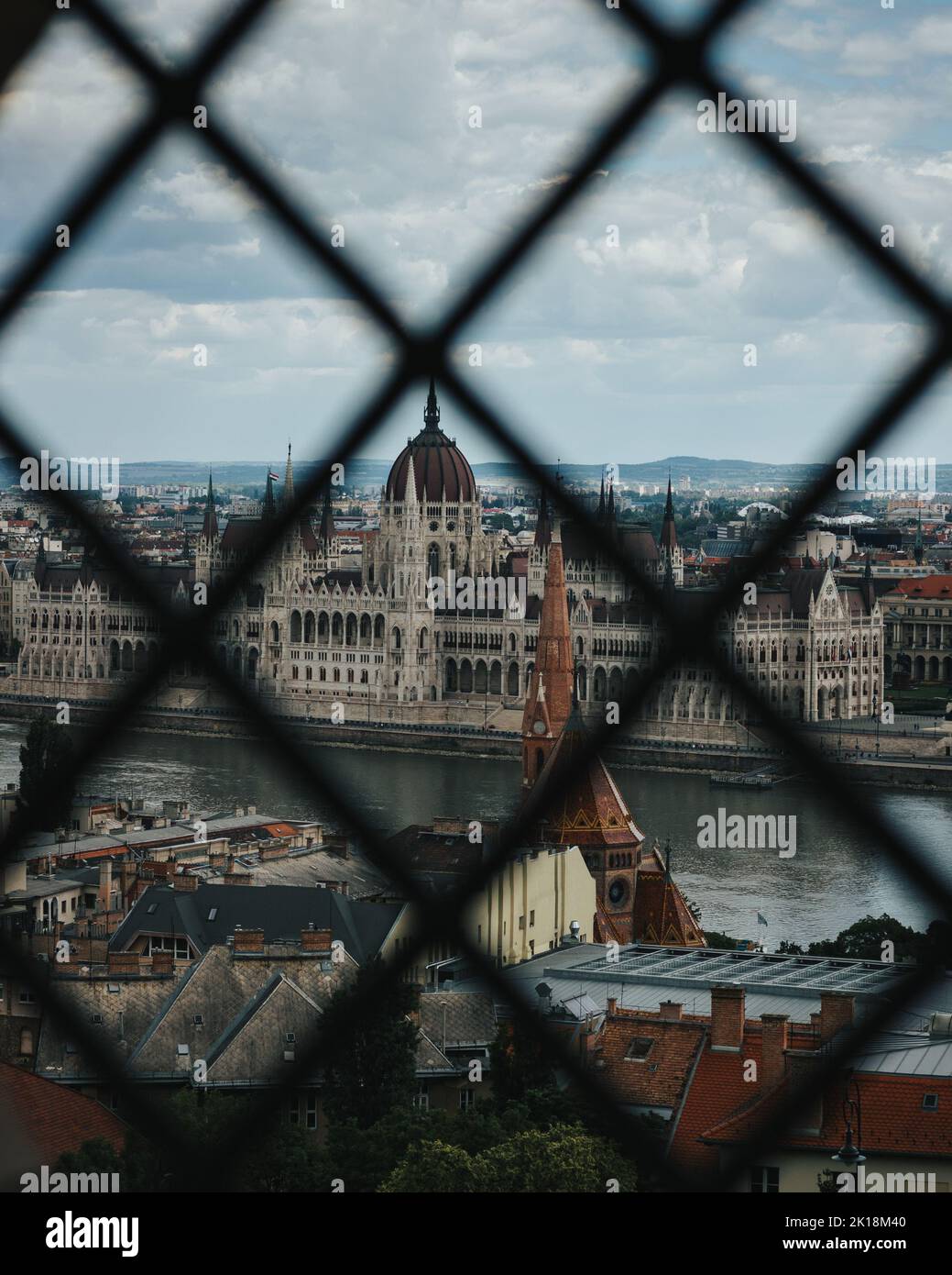 The Hungarian Parliament Building through a wire mesh window in ...