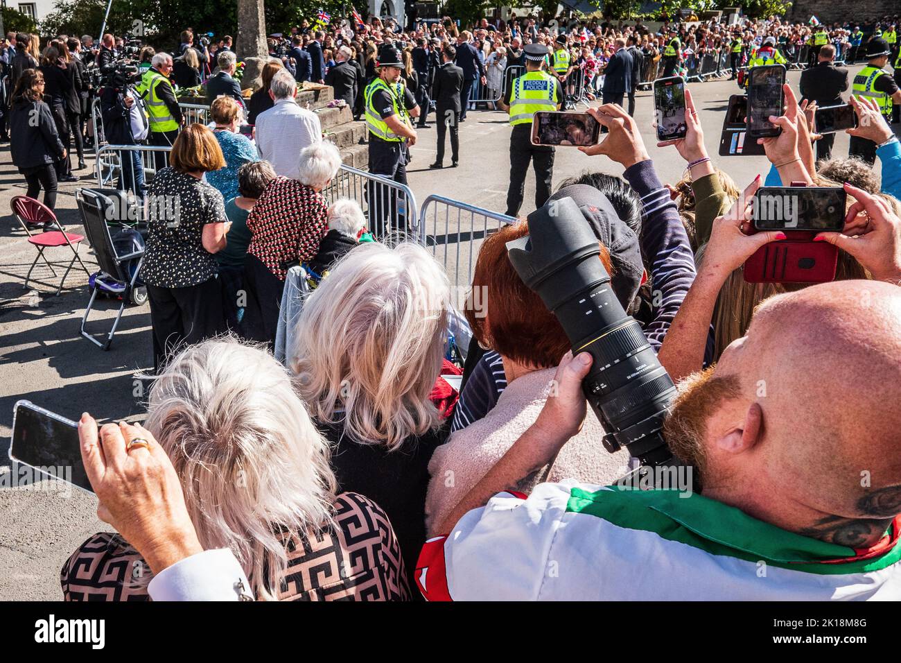 Crowds photographing King Charles III using mobile phones at Cardiff ...
