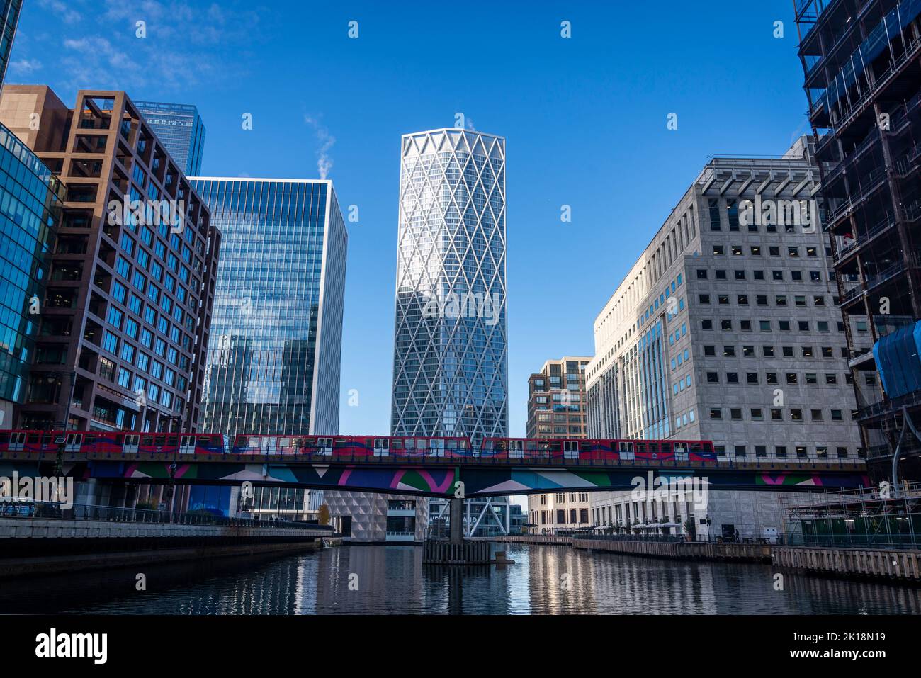 Docklands Light Railway train running over a bridge, with Newfoundland ...
