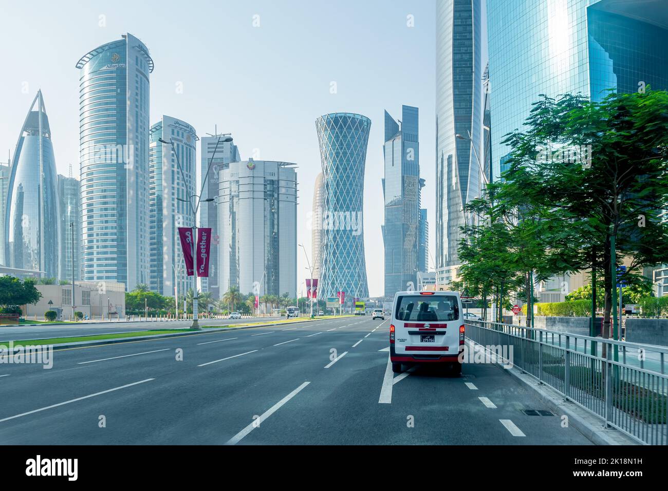 Road traffic at financial centre in Doha - Beautification of Doha roads FIFA Qatar World cup ...