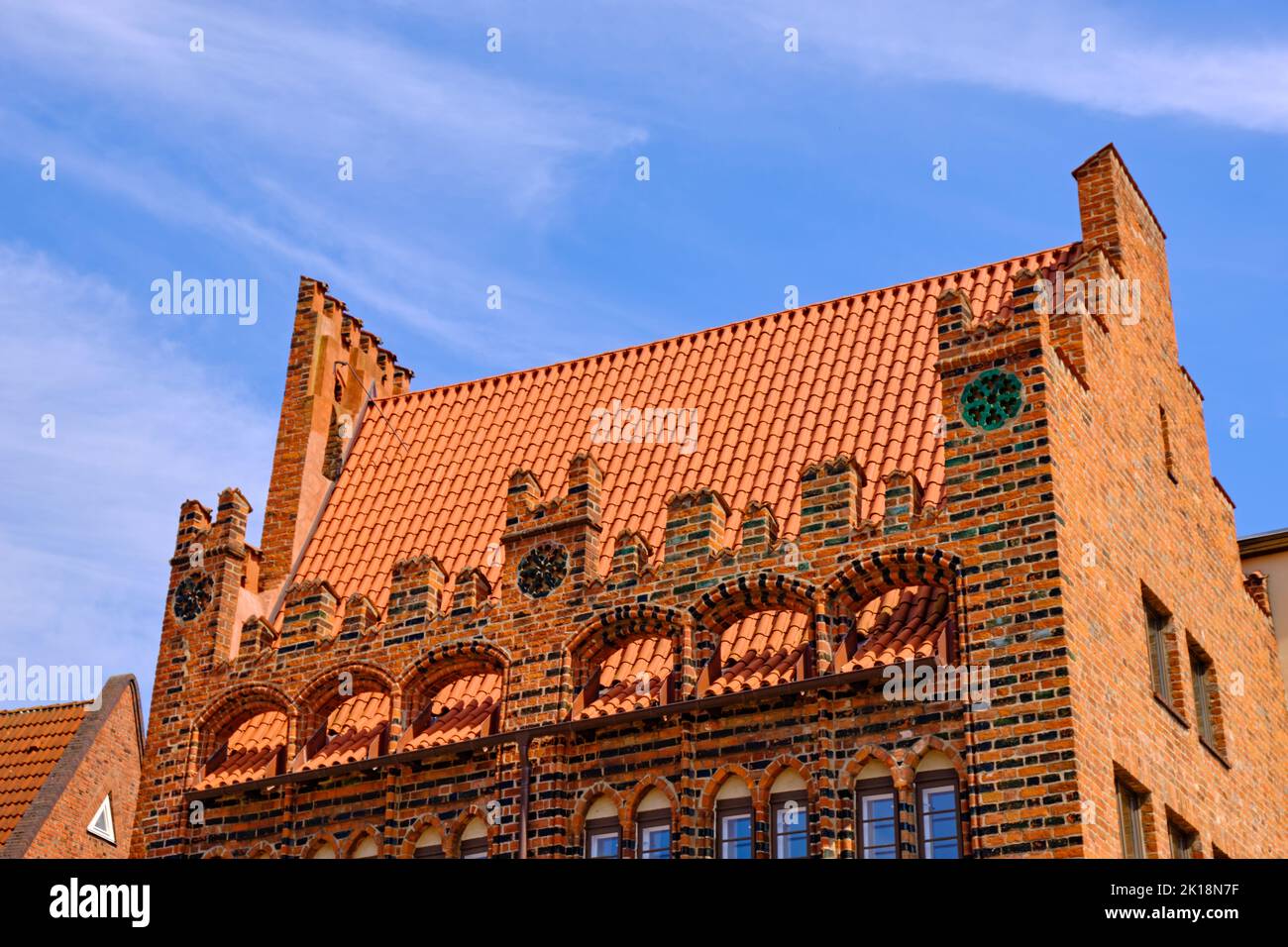 Roof part and gables of a historical brick building, Archdeaconry in ...