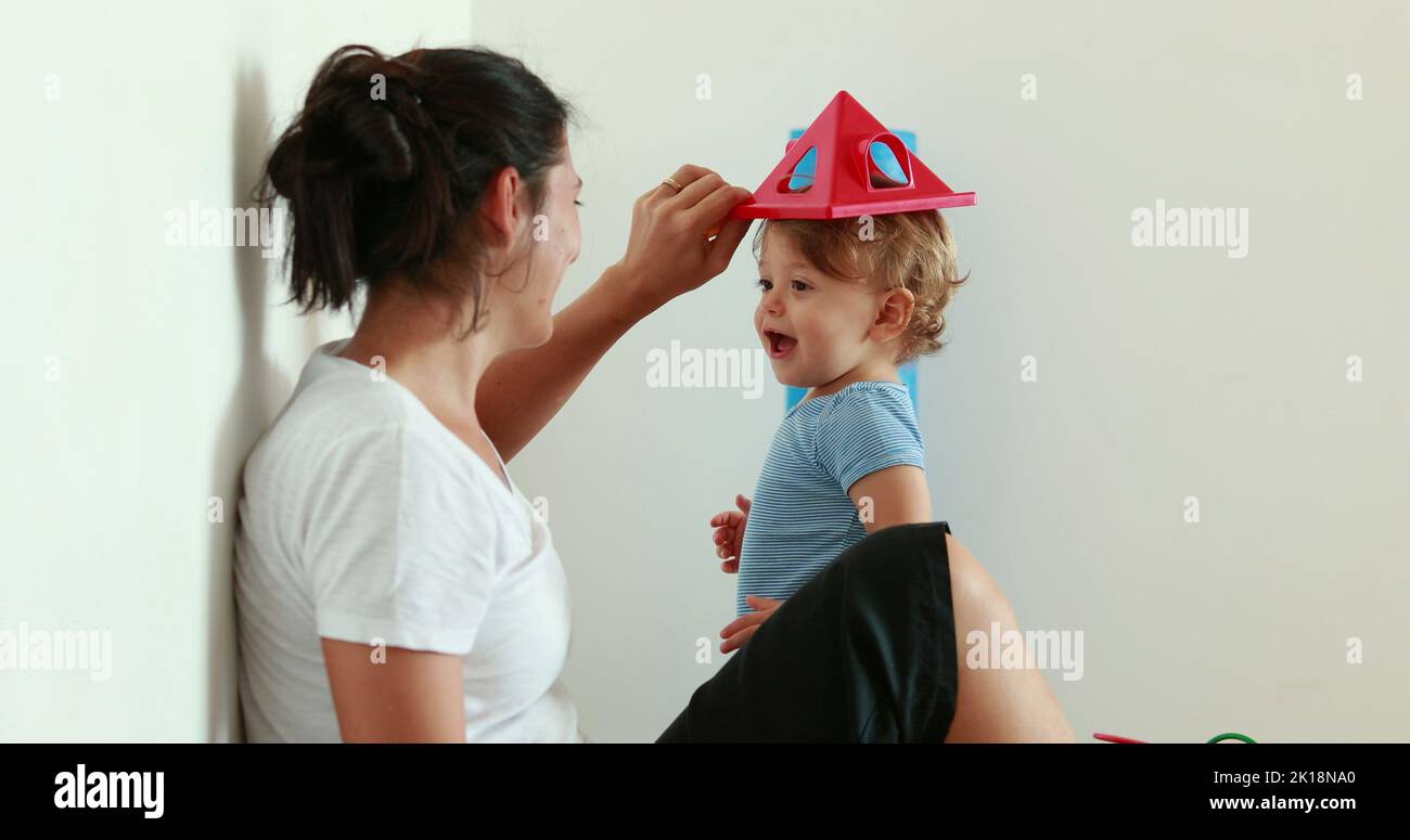 Authentic cute mother and one year old baby child interaction. Candid ...