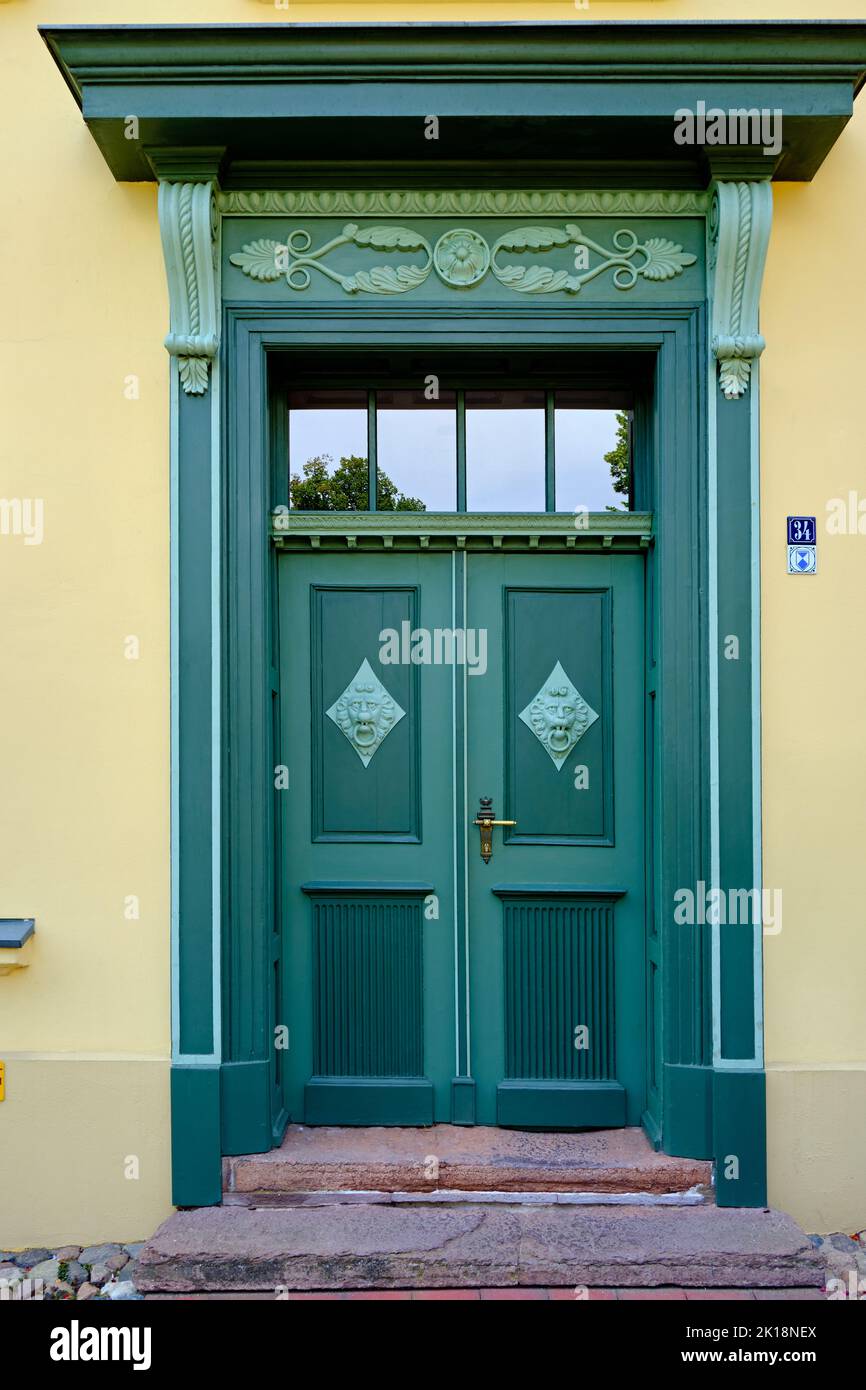 Richly decorated historical front door in green with house no. 34 next ...