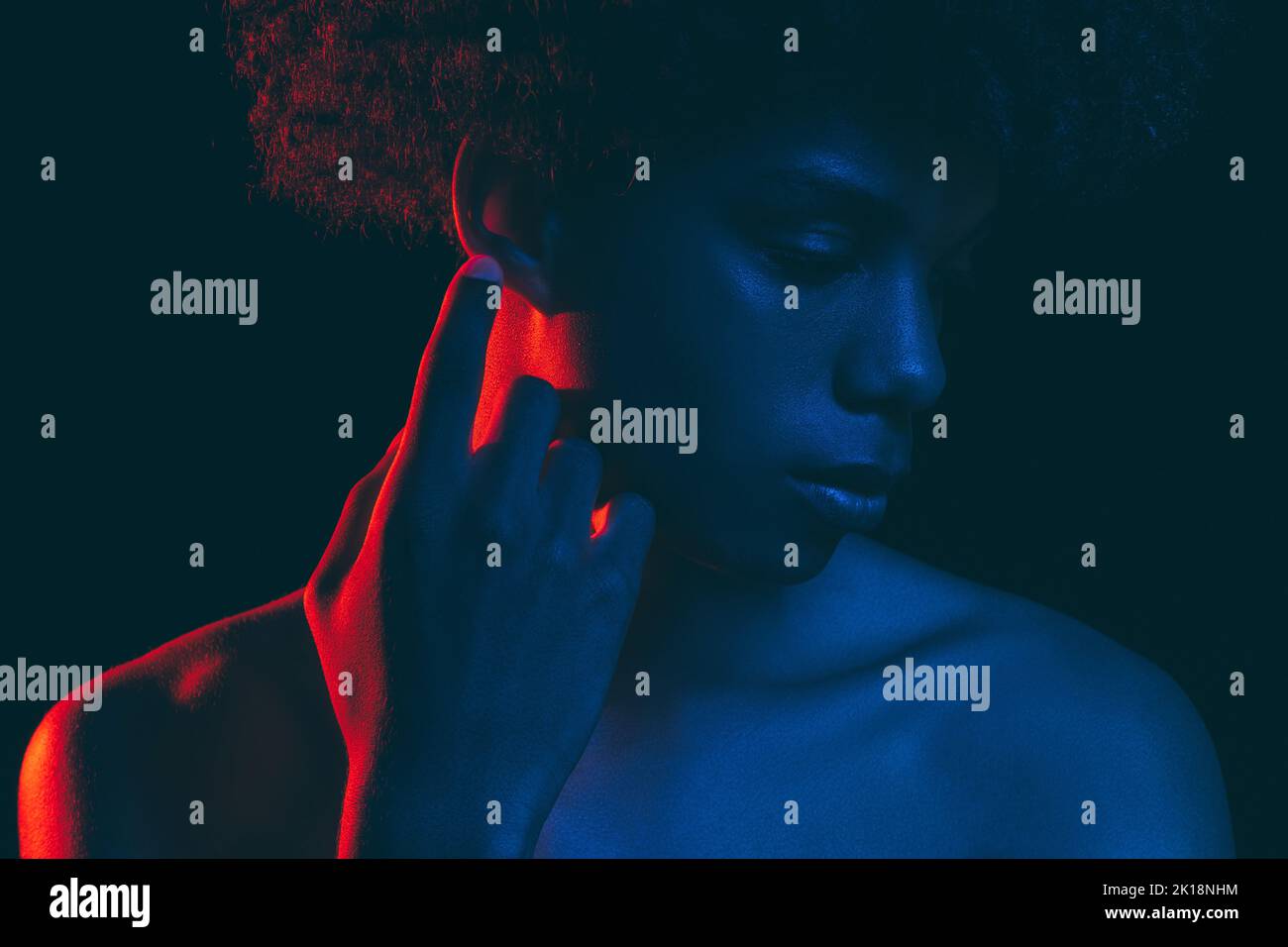 Black man silhouette. Neon light portrait. African guy in blue red glow ...