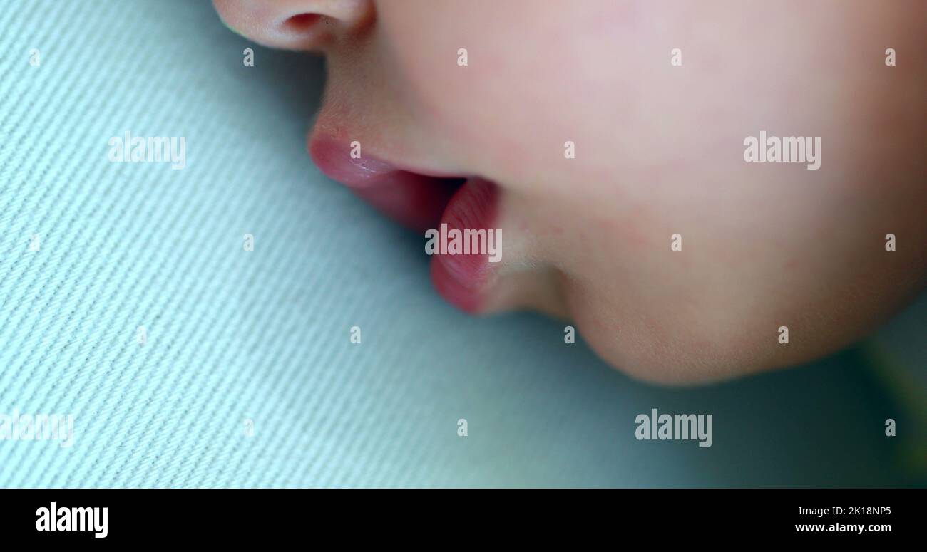 Baby macro close-up mouth drooling napping Stock Photo - Alamy