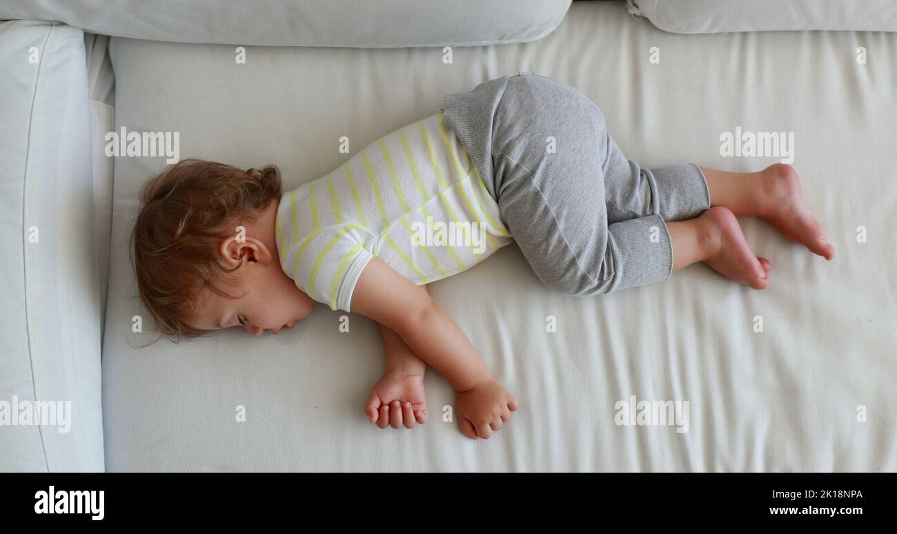 Baby napping in afternoon. From above angle of infant one year old ...