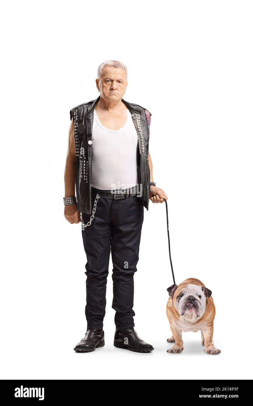 Full length portrait of a mature grumpy punk standing with a bulldog ...