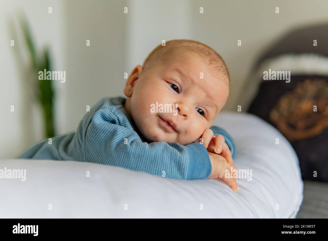 baby chilling on a pillow, young 1 month Stock Photo - Alamy