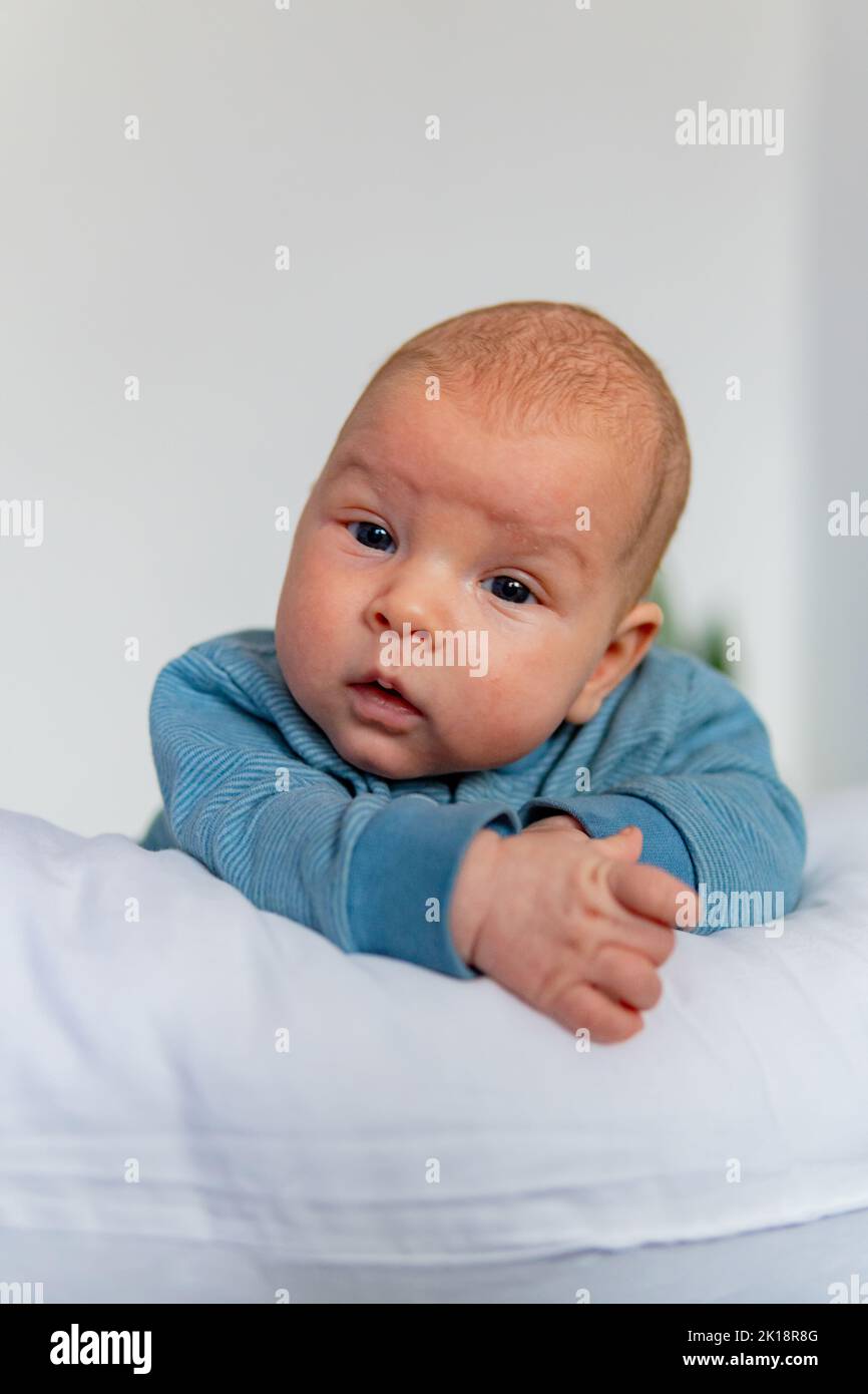 baby chilling on a pillow, young 1 month Stock Photo - Alamy