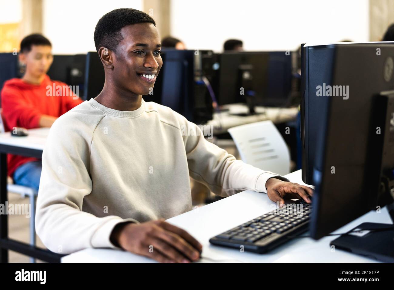 Young African student having an exam in high school - Education and ...