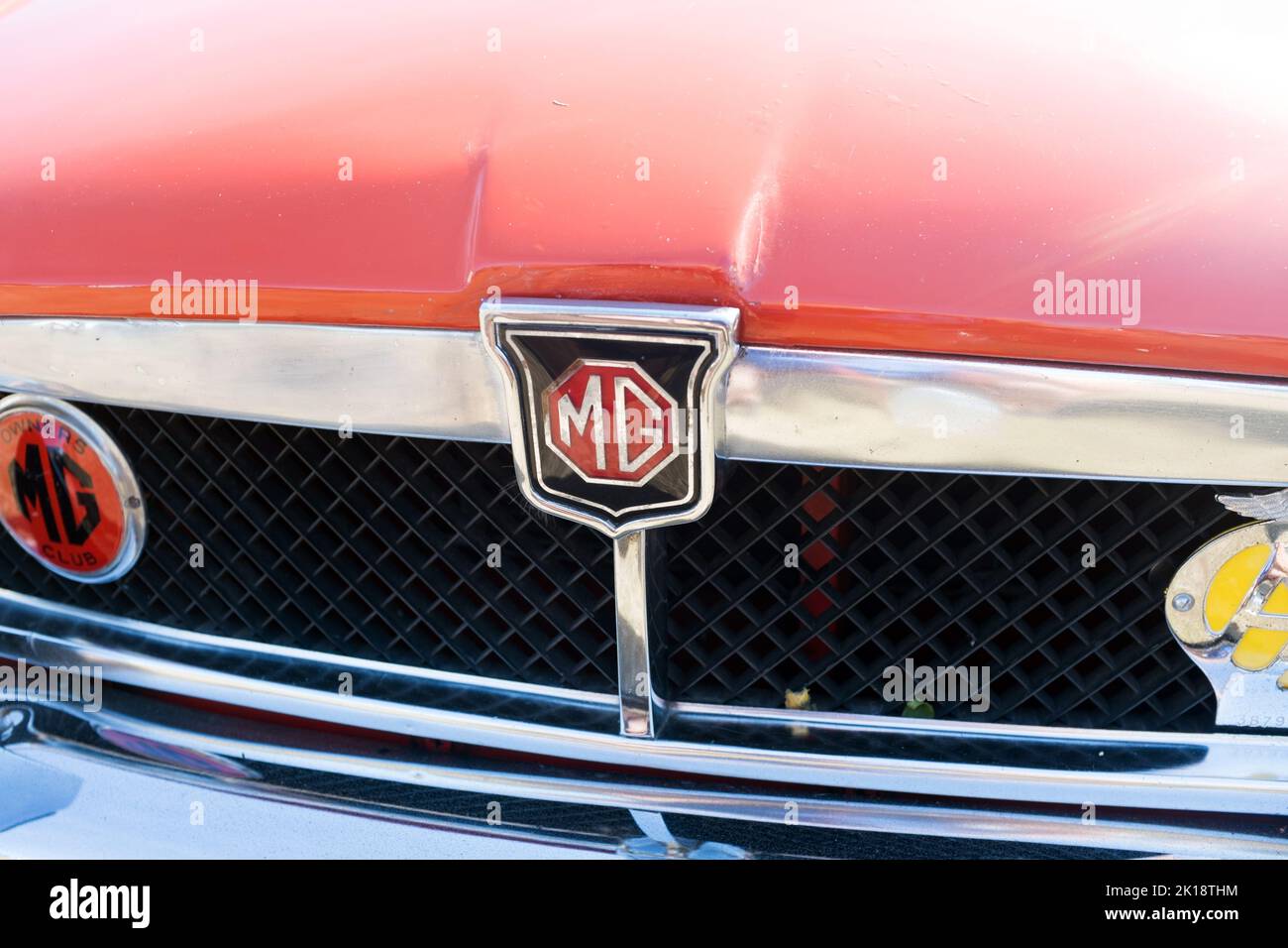 Shiny polished red Bonnet of a classic MG car at a car rally in Saffron ...