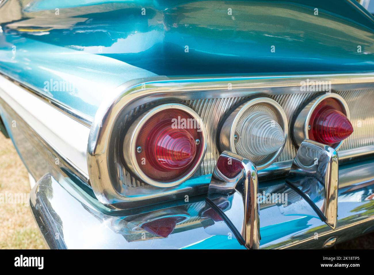 Brake lights on a shiny polished classic American car at a car rally in ...