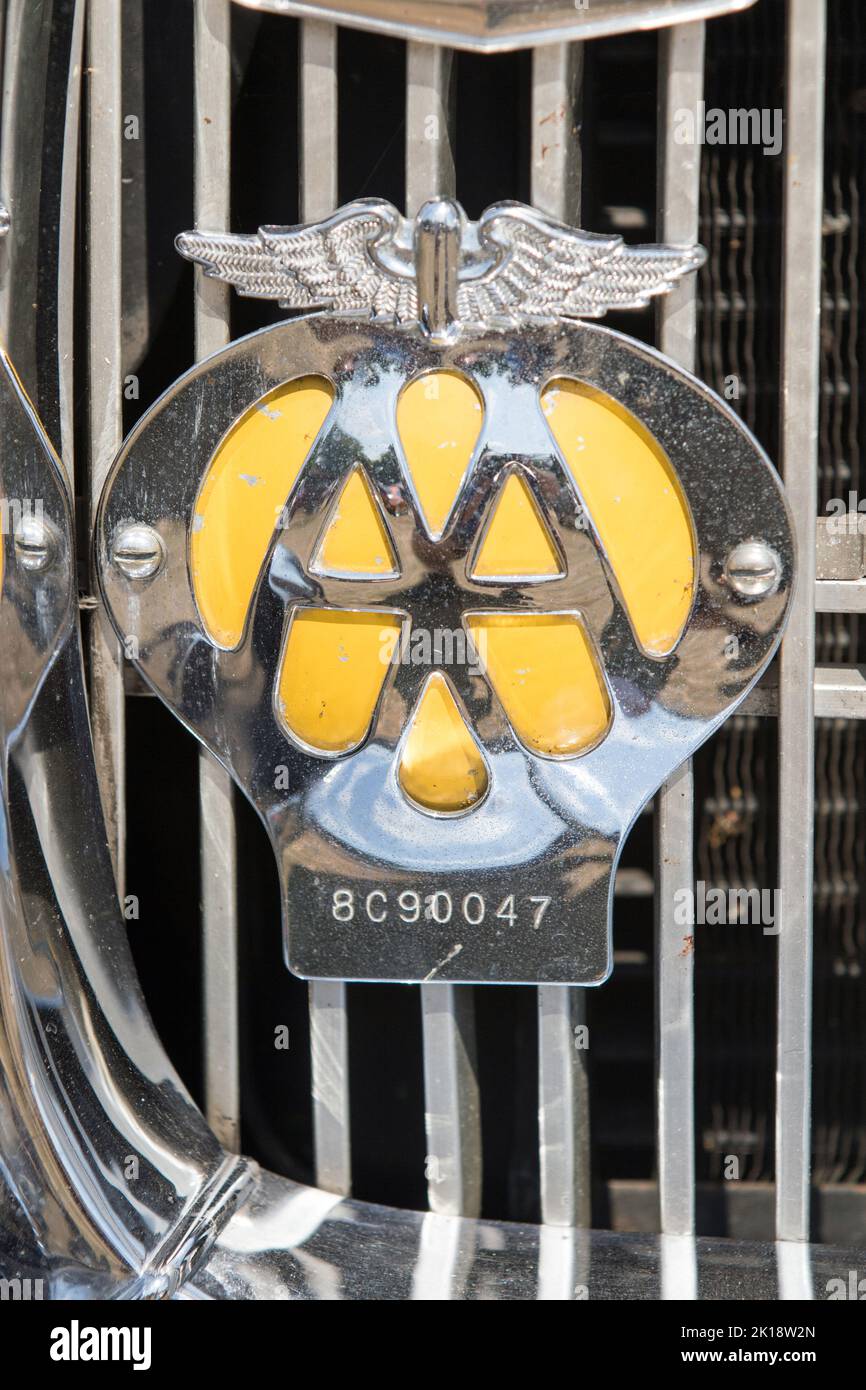The AA (Automobile Association) badge on the radiator grill of a ...