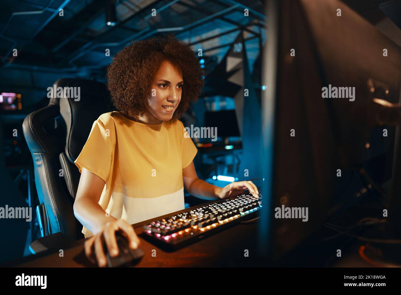 Girl cyber gamer plays computer game tournament Stock Photo - Alamy