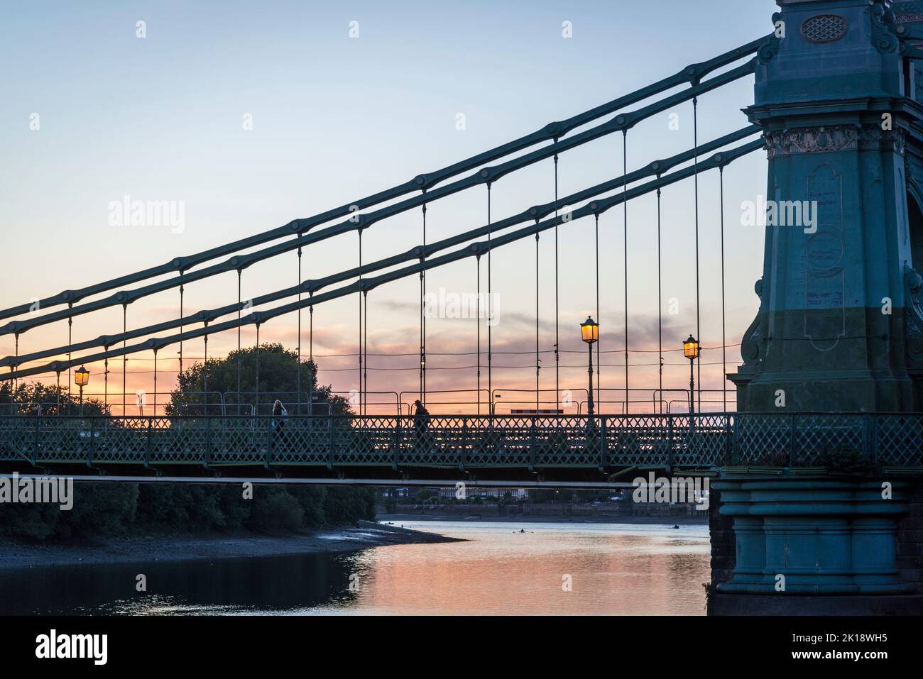 Hammersmith Bridge and the River Thames at sunset, London, England, UK ...