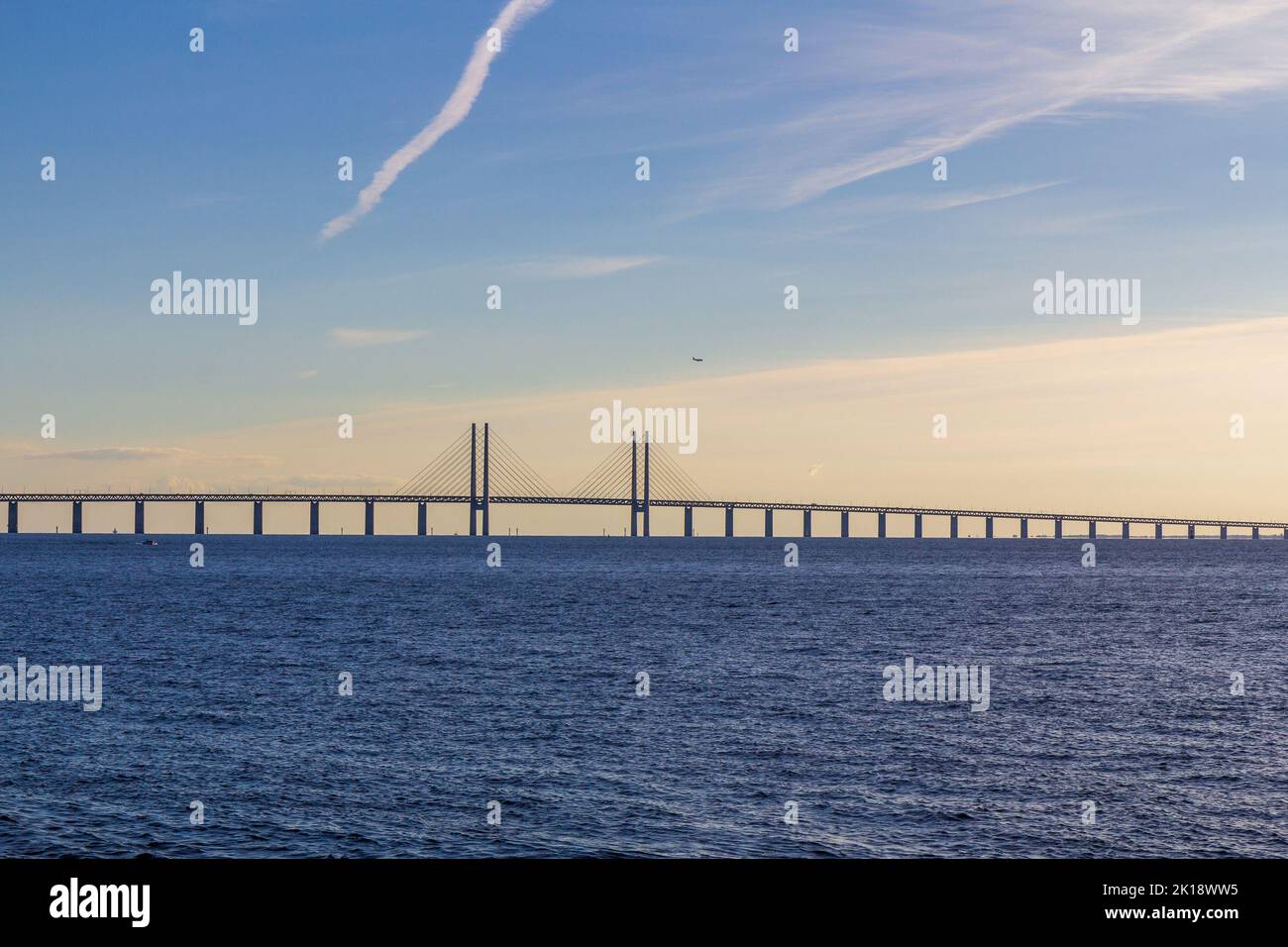 The Öresund bridge connecting Denmark and Sweden while a plane flies ...