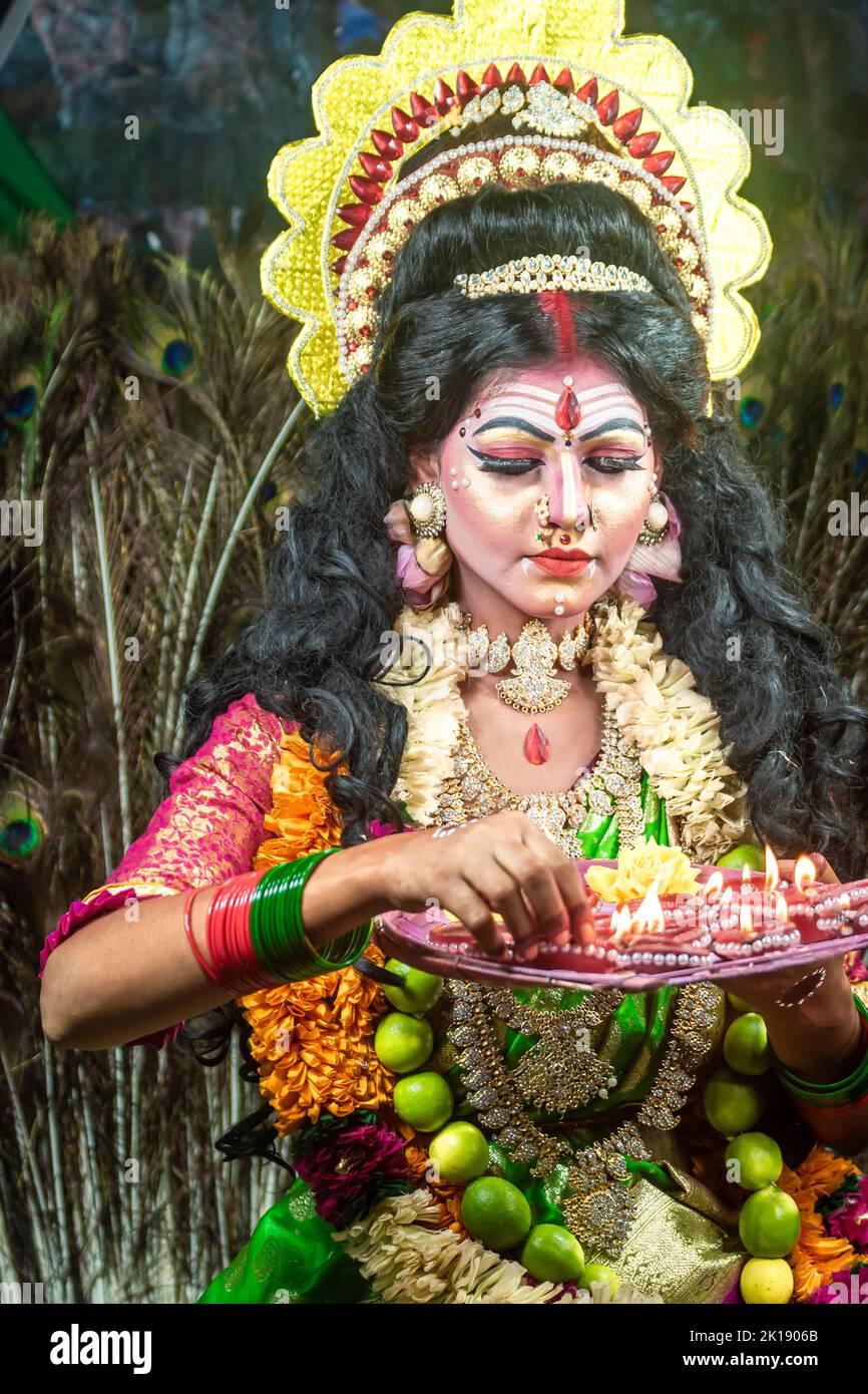 Concept Agomoni shoot with black haired Indian brunette woman face with ...