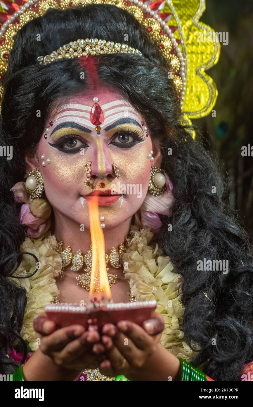 Concept Agomoni shoot with black haired Indian brunette woman face with ...