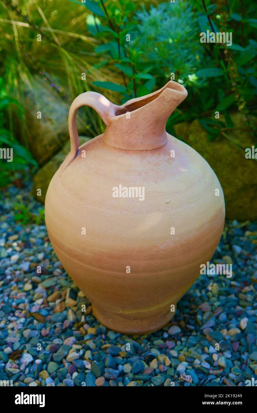 An old terracotta pot in the garden Stock Photo - Alamy