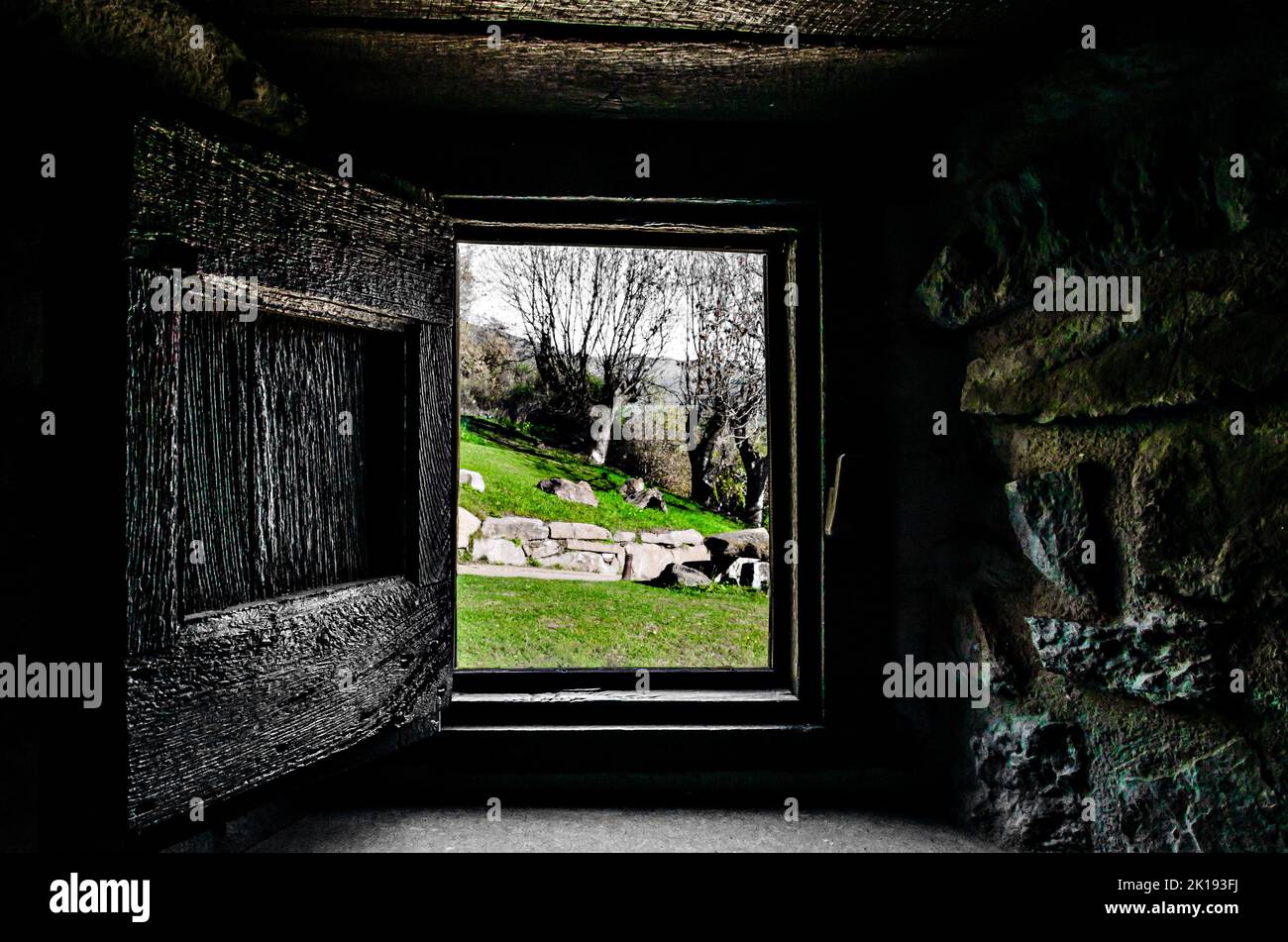 Interior view from the window of a rustic house towards a beautiful ...