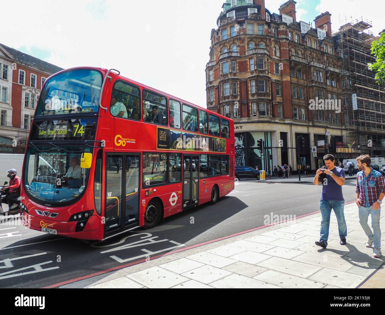 A red bus on the street of London Stock Photo - Alamy