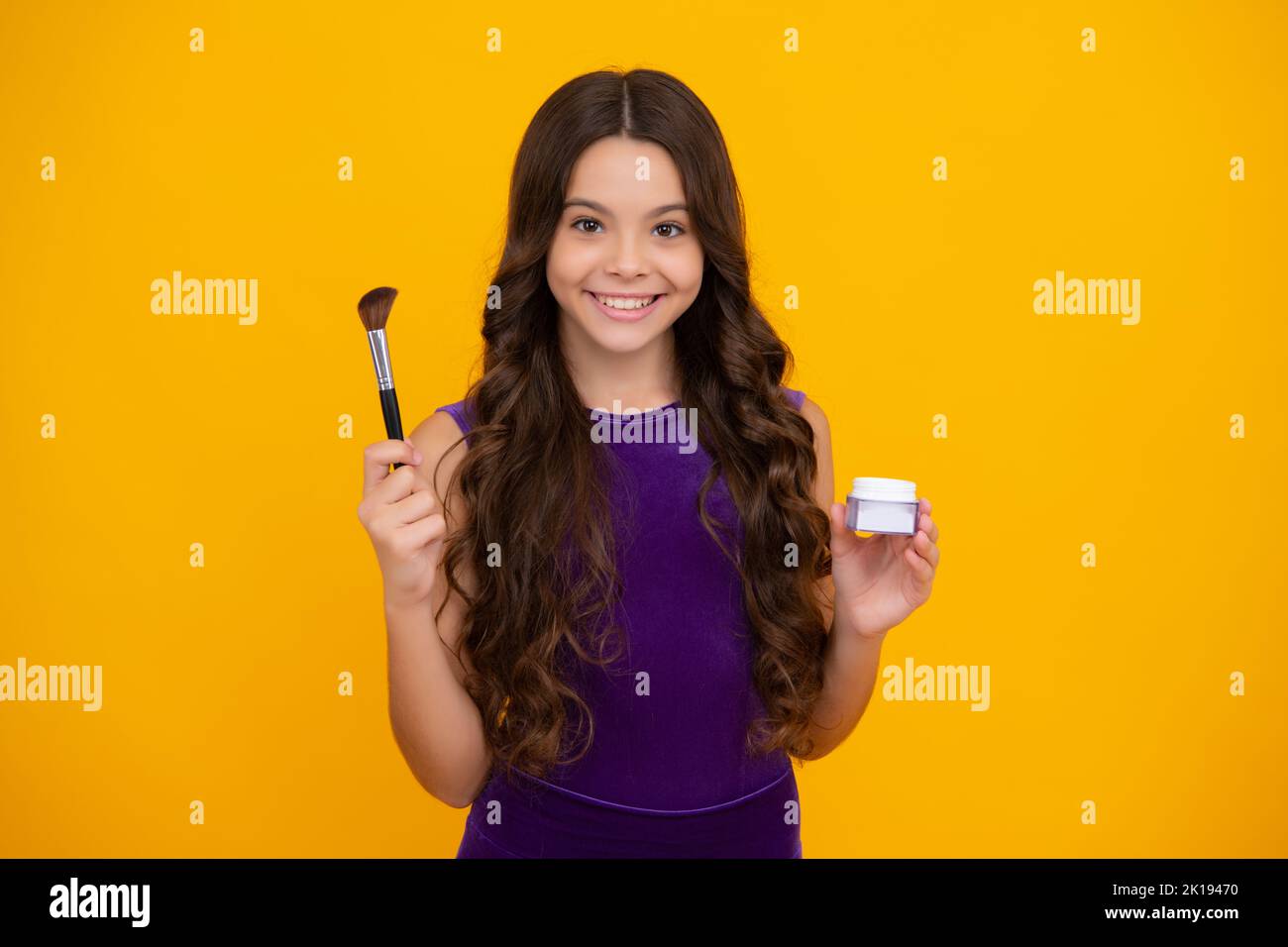 Beautiful portrait of teen girl child artist apply powder with make up ...