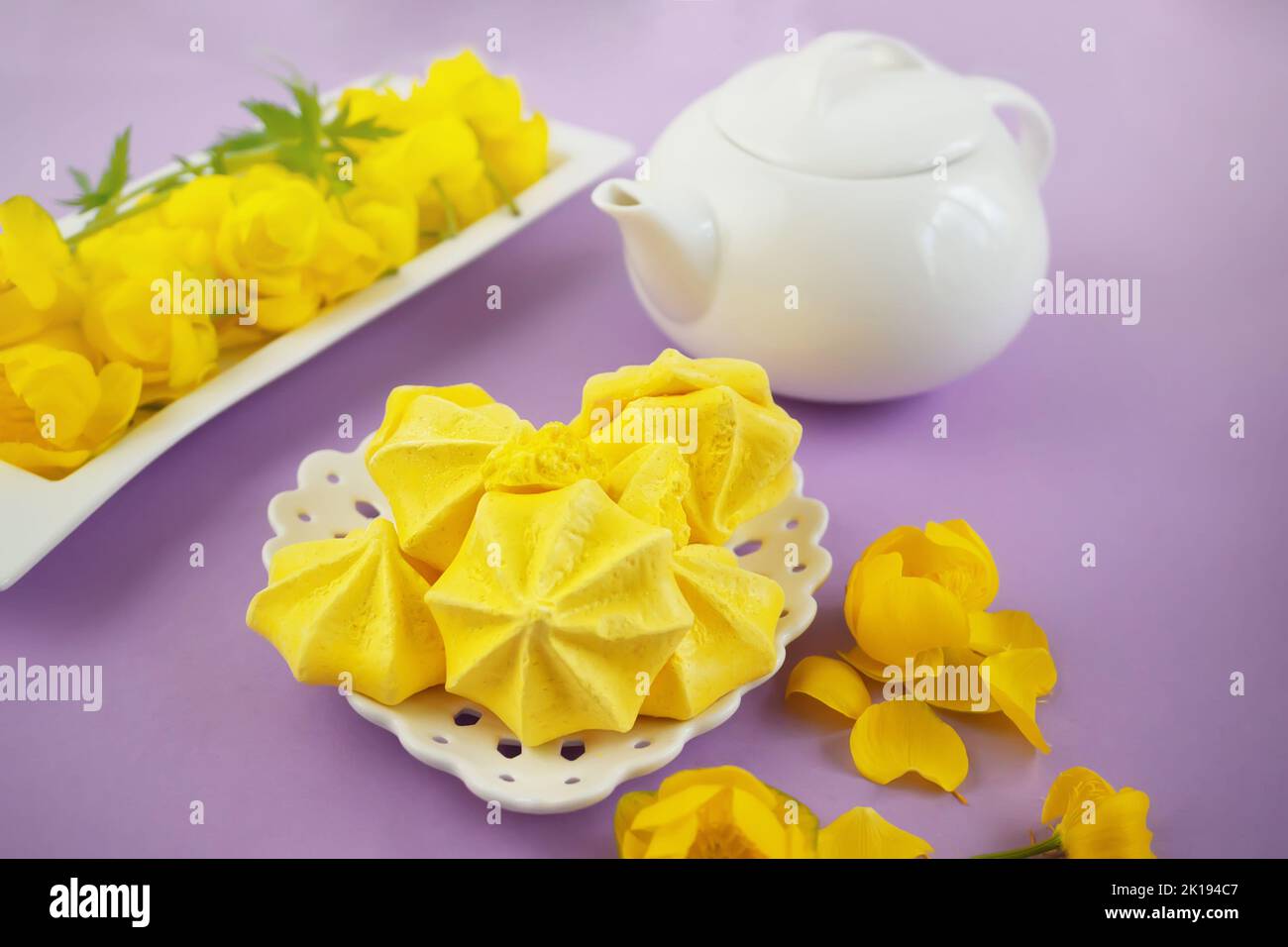 yellow meringue on a heart - shaped plate . Still life of meringue and ...