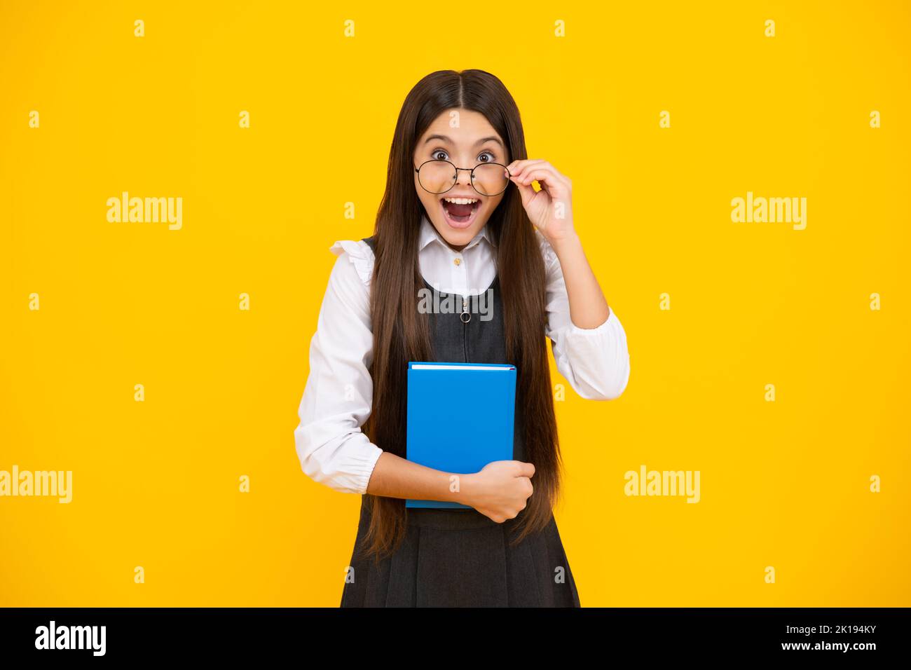 Teenage school girl with books. Schoolgirl student. Surprised face ...