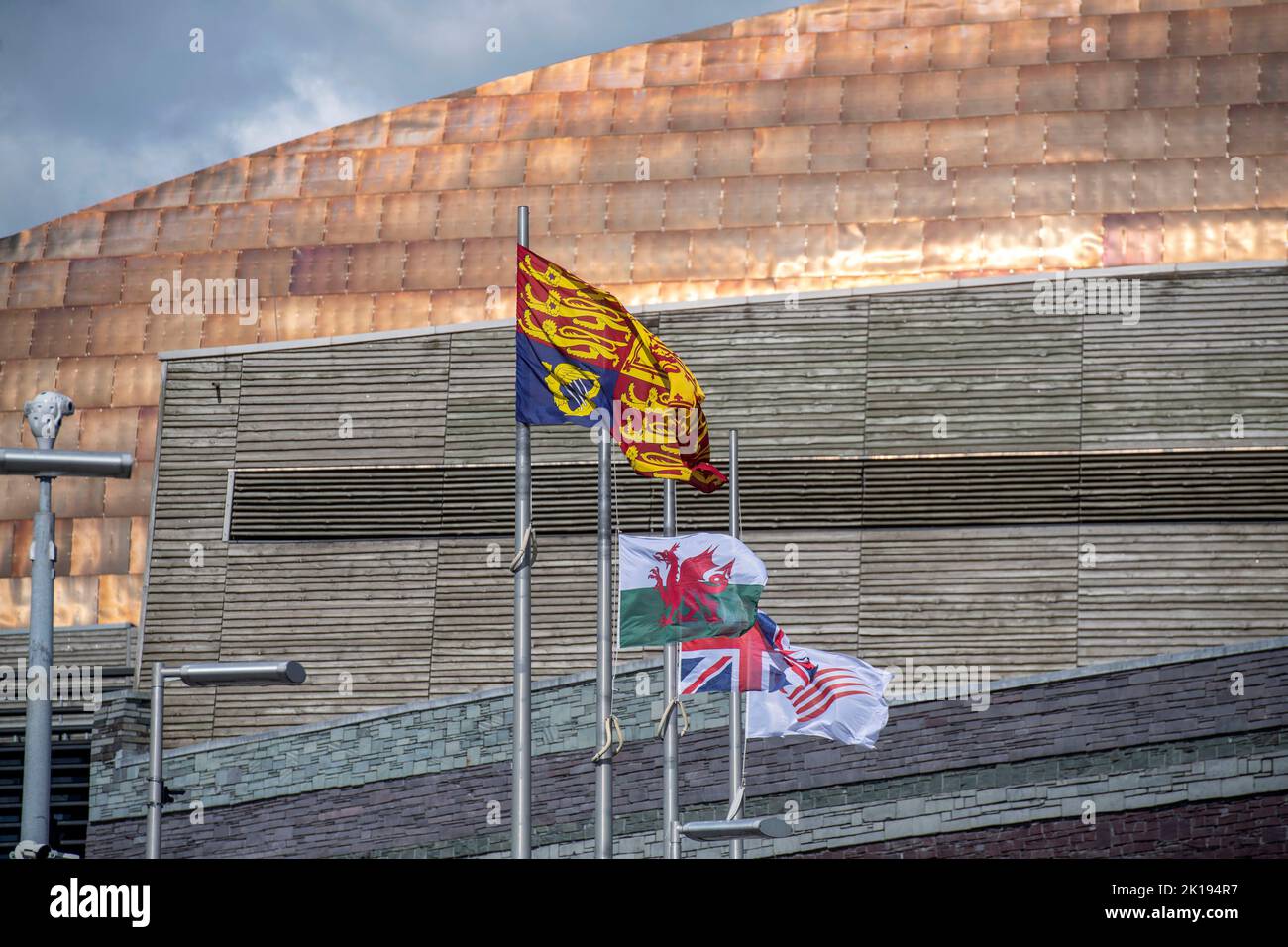 Cardiff, UK. 16th Sep, 2022. The Union Jack and Welsh flag fly at half ...