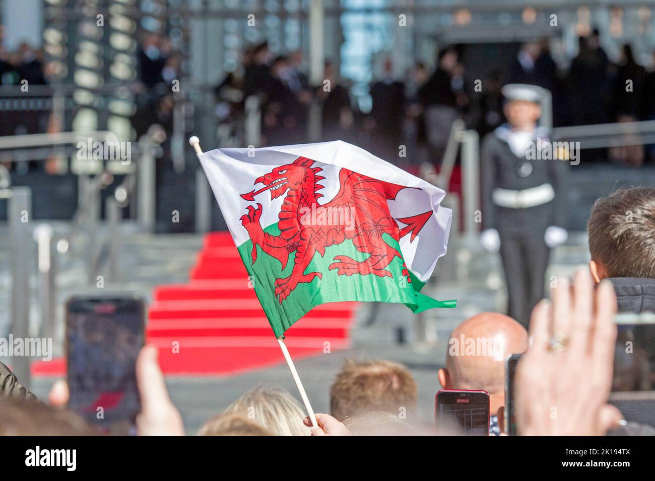 Cardiff, UK. 16th Sep, 2022. Welsh flag is waved about as King Charles ...