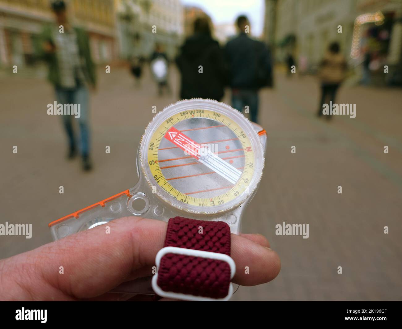 A compass in a person's hand. Orient yourself in the current situation ...