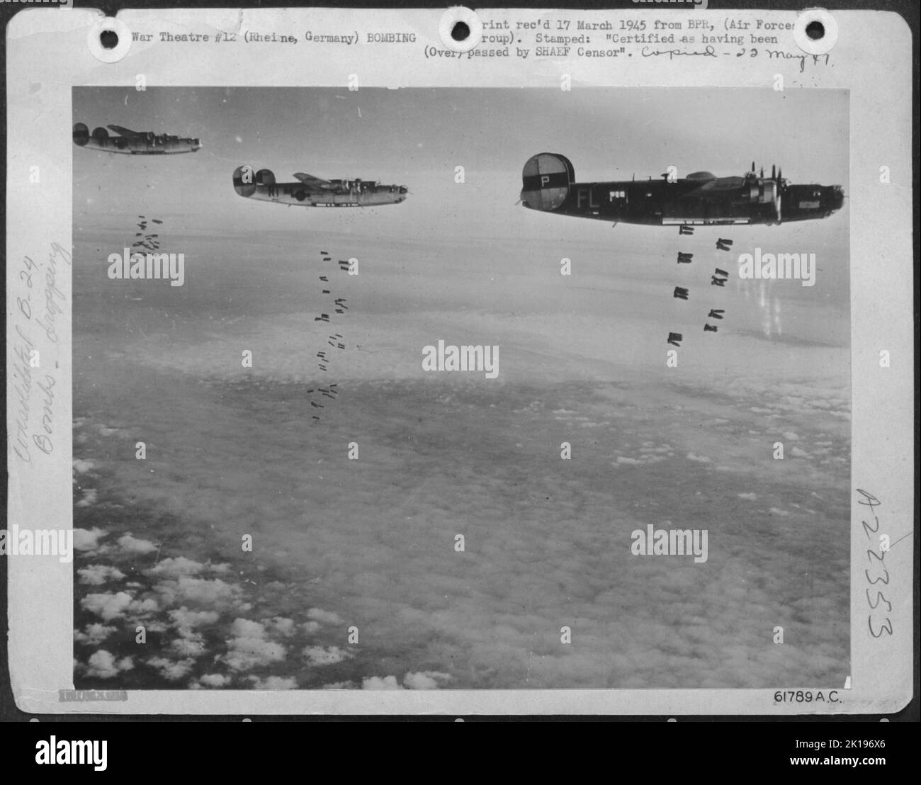 Bombs Drop From The Open Bomb Bays Of Three Consolidated B-24 ...