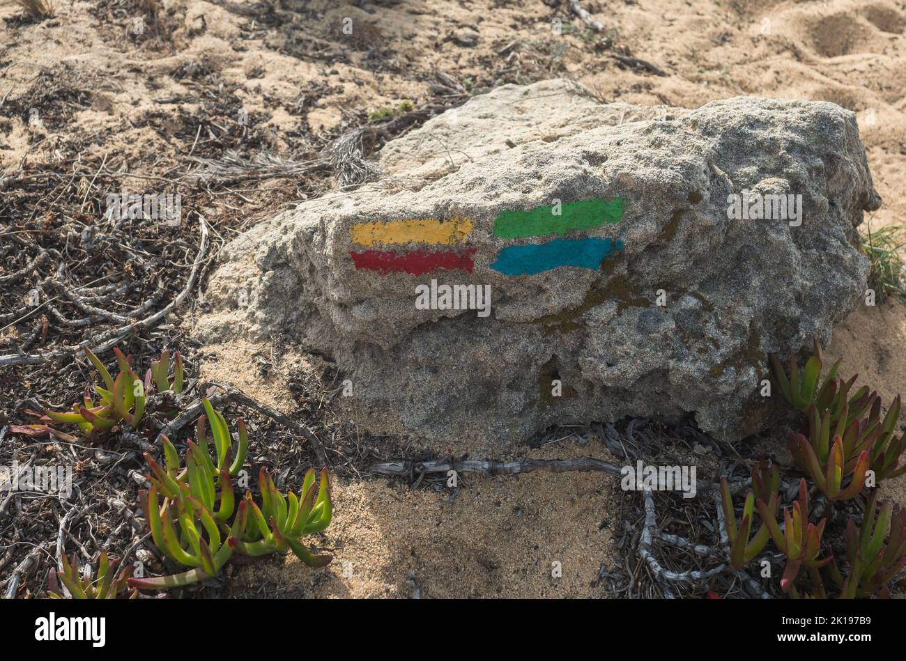 Sandstone stone with blue and green sign of Fishermans trail and red ...