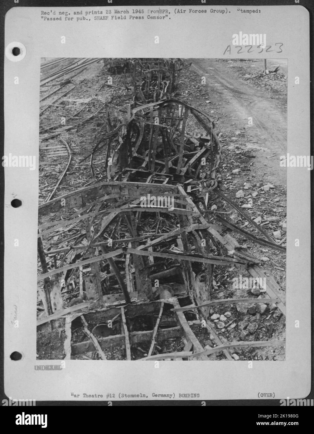 Gutted freight cars and twisted tracks in the railroad yard at Stommeln ...
